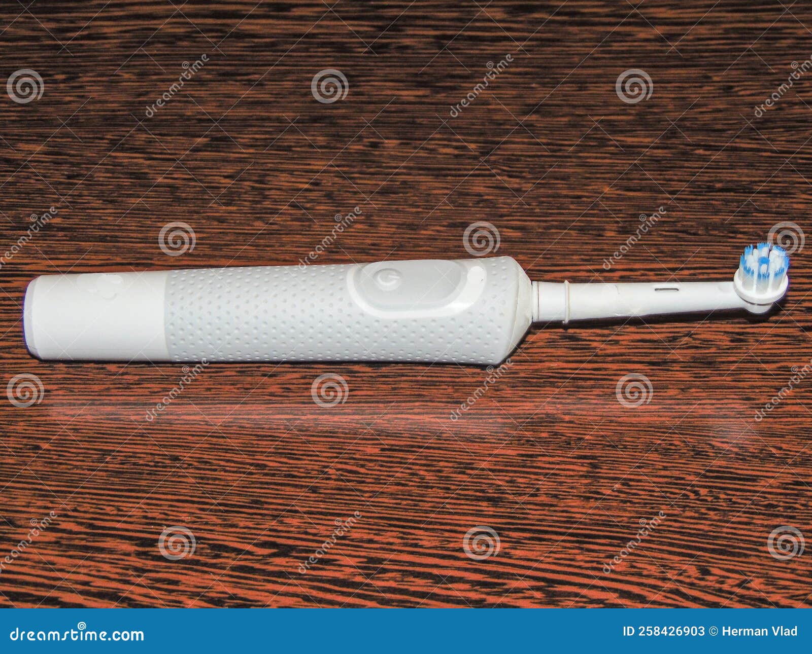 White Electric Toothbrush on a Wooden Background Stock Image - Image of ...