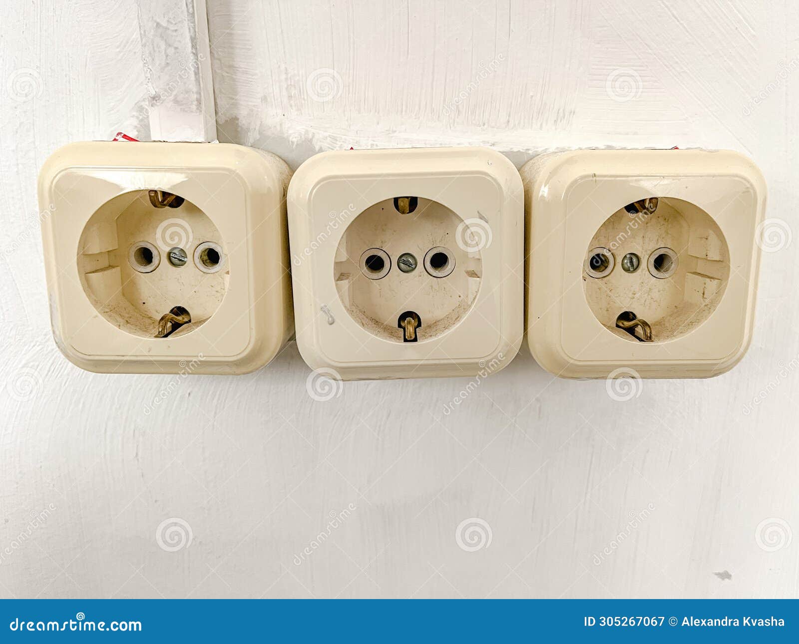 A White Electrical Outlet on the Wall in the Room. an Electric Plug ...