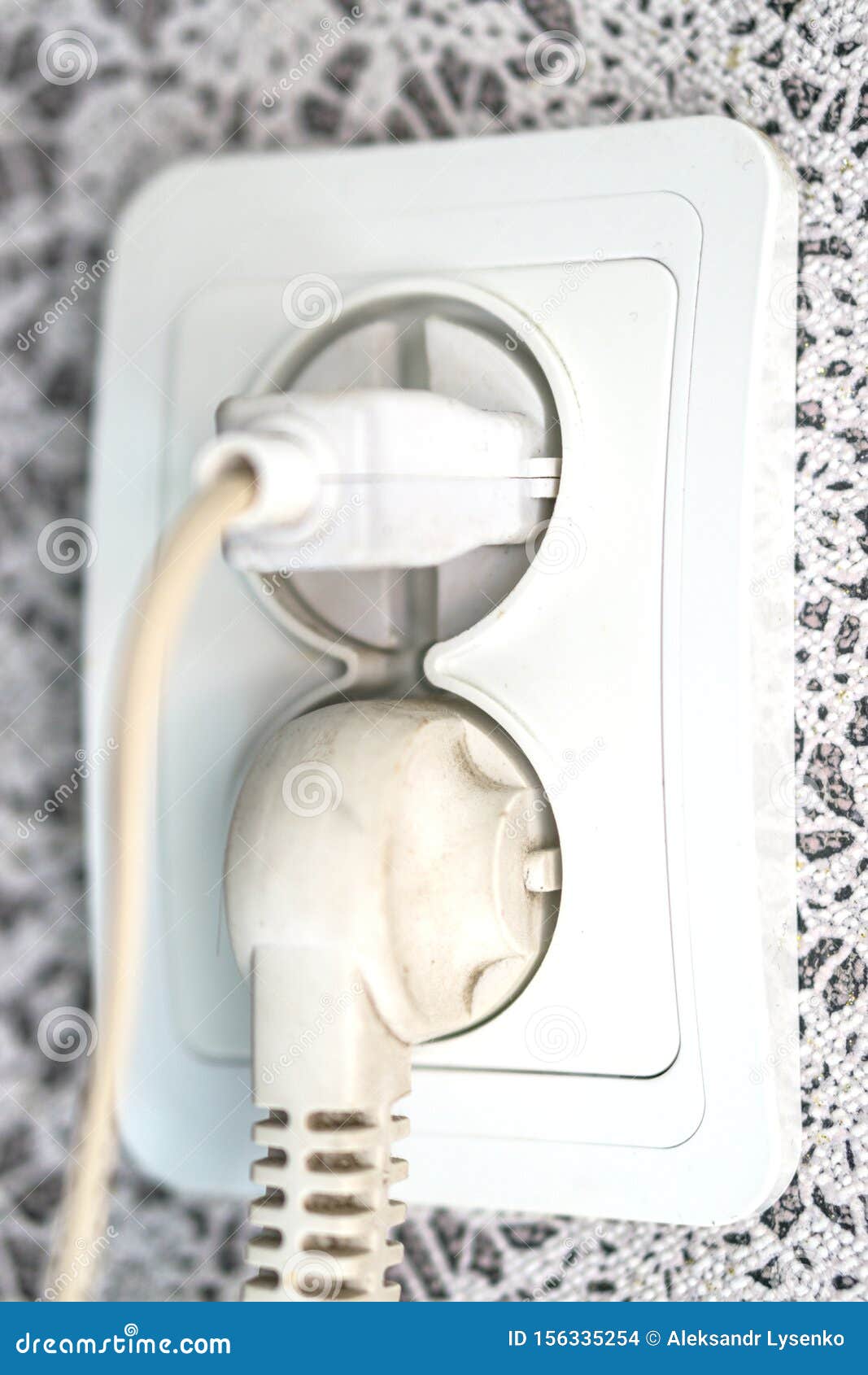 White Electrical Plug in the Electric Socket on Wall. Connected Ac ...