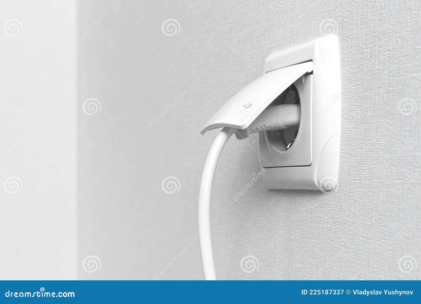 White Electrical Plug in the Electric Socket on a Wall, Interior Photo ...