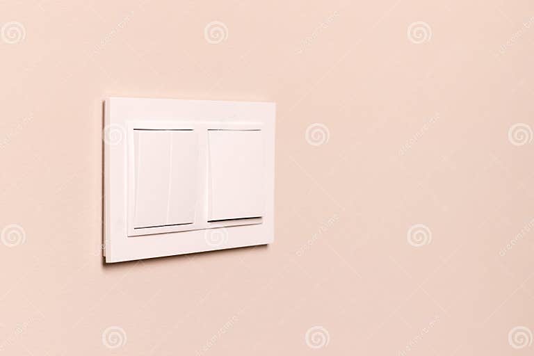 White Electrical Switches on Beige Wall Stock Photo - Image of ...