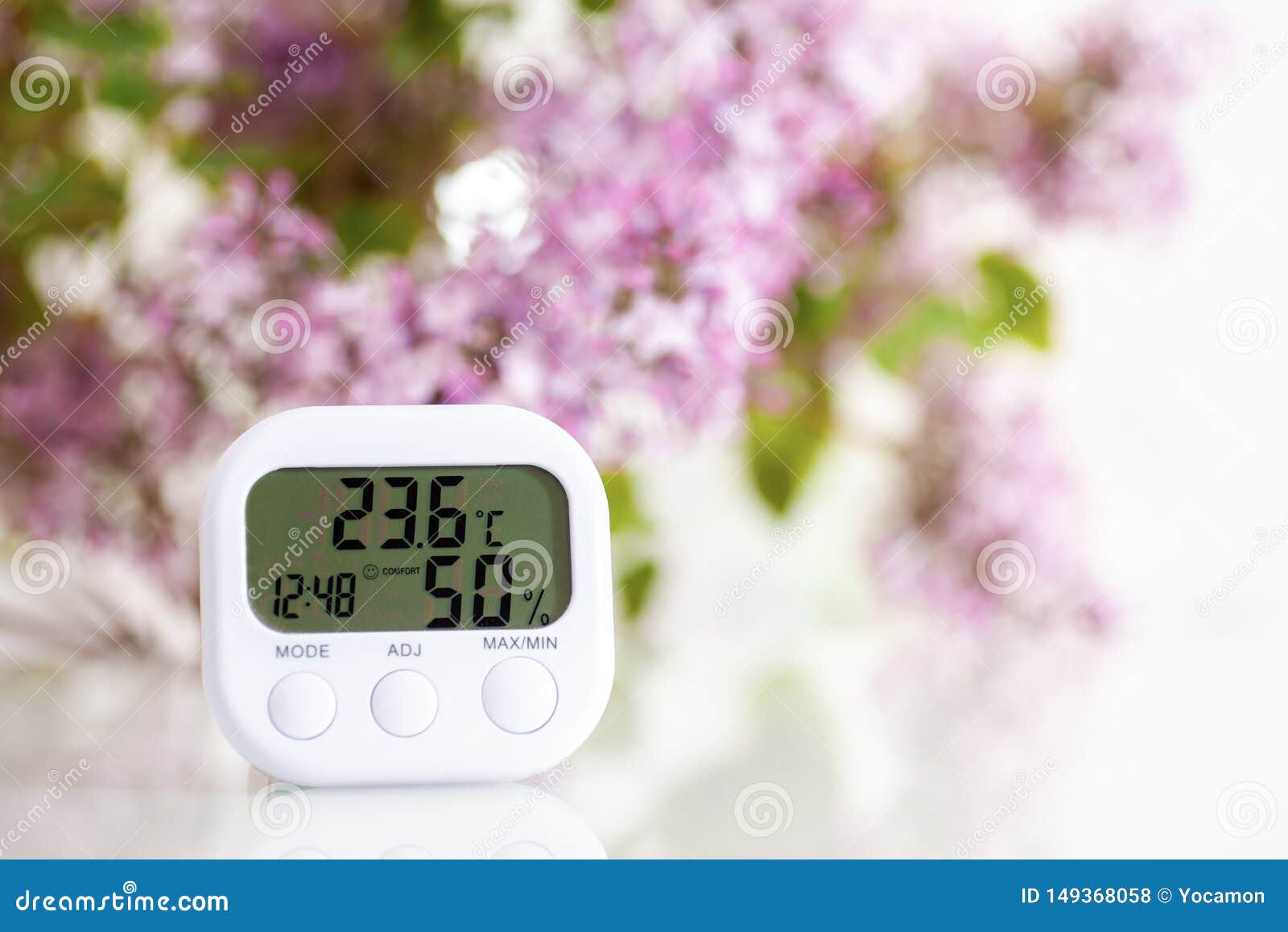 White Electronic Hygrometer on White Table Stock Photo - Image of ...