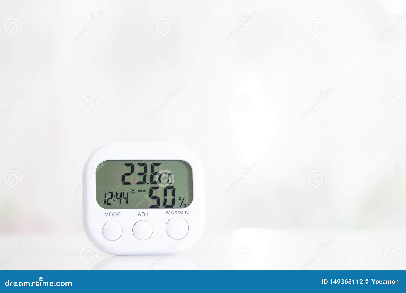 White Electronic Hygrometer on White Table Stock Photo - Image of ...