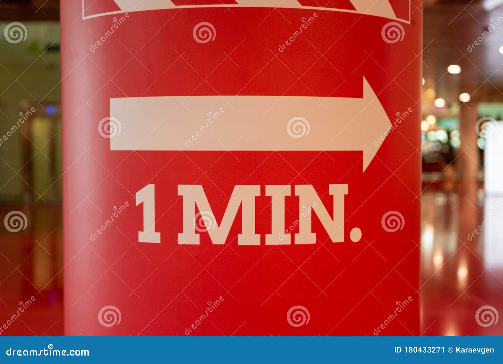 Red And White Emergency Exit Sign With Arrow On A Gate At A Pedestrian ...