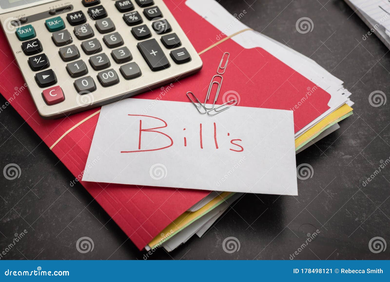 White Envelope with the Word Bills Written on it with Paper Clip Arrow ...