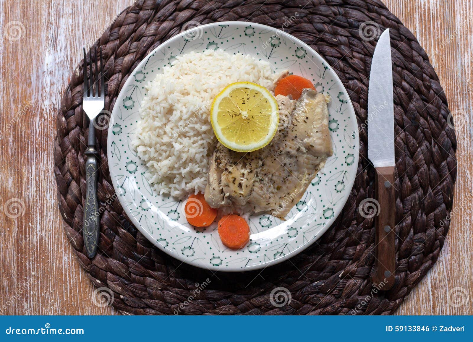White Fish Served at the Table with Lemon and Rice Stock Photo - Image ...