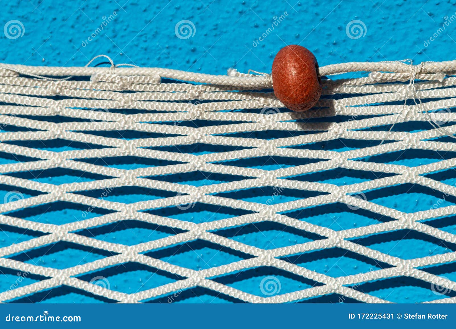 A White Fisher Net Hanging on a Blue Wall Stock Image - Image of blue ...