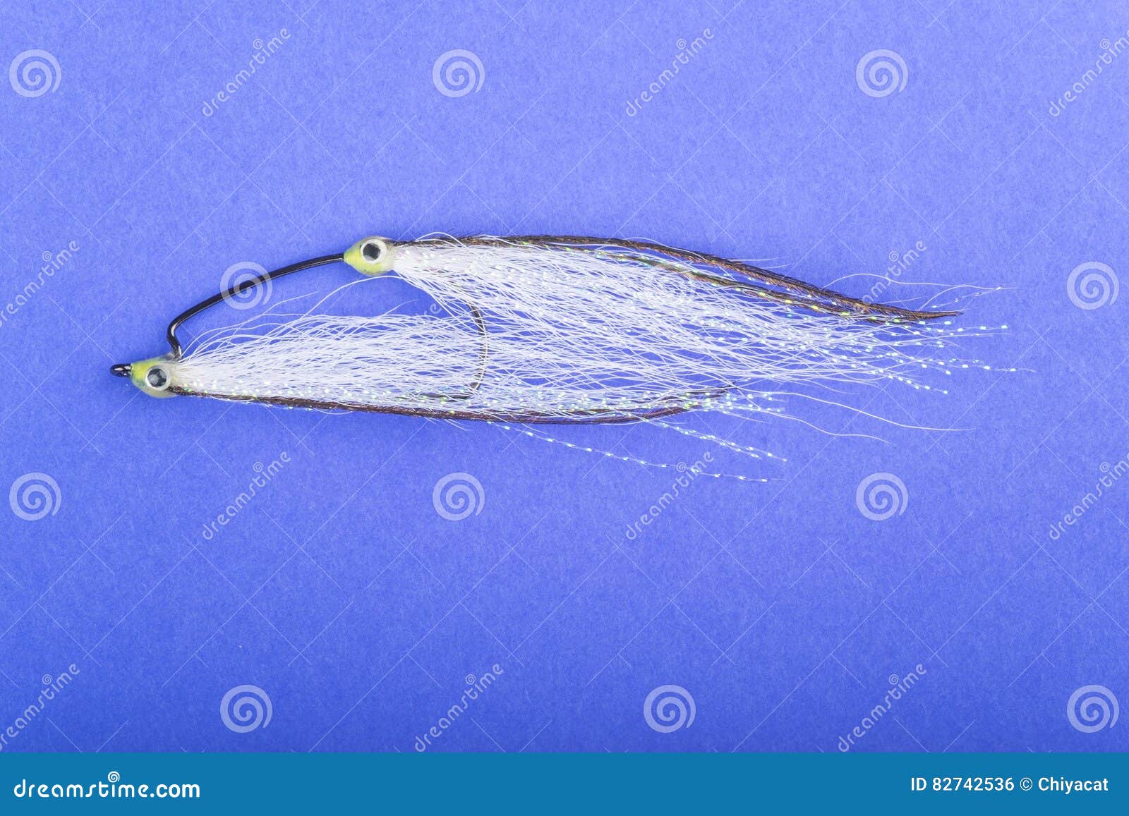 White Fishing Fly on Purple 2 Stock Photo - Image of handmade, hand ...