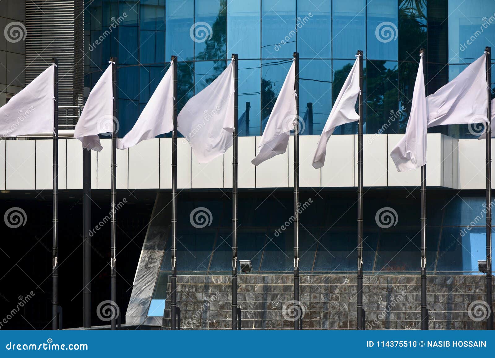 White Flags in Front of a Modern Architectural Building Photograph ...