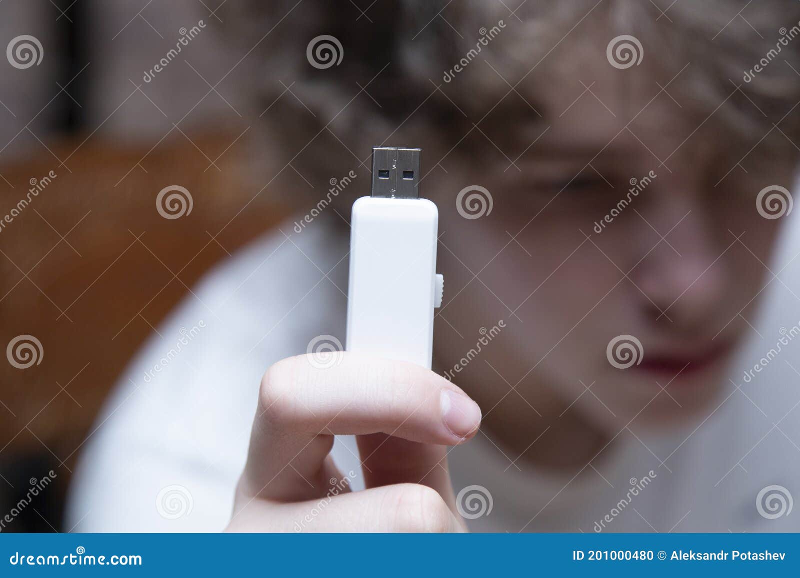 White Flash Drive in the Hands of a Teenager Stock Photo - Image of ...