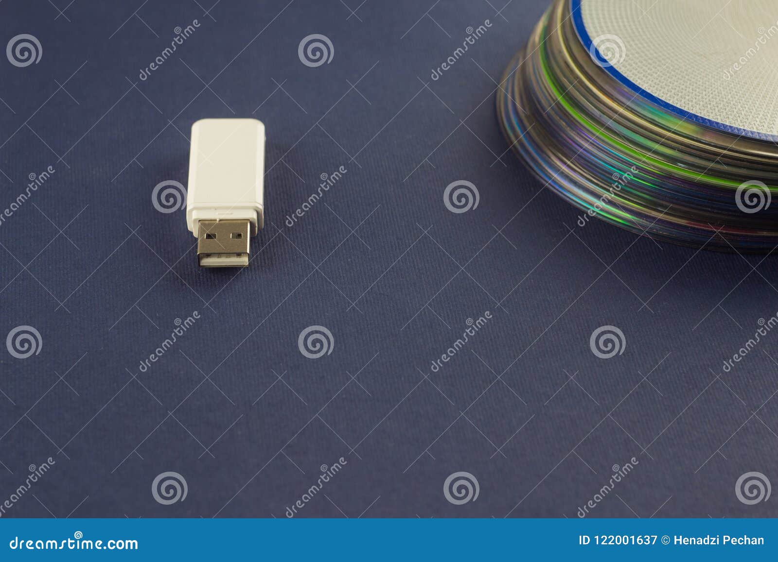 White Flash Drive and a Stack of CD, DVD, Computer, White Flash Drive ...