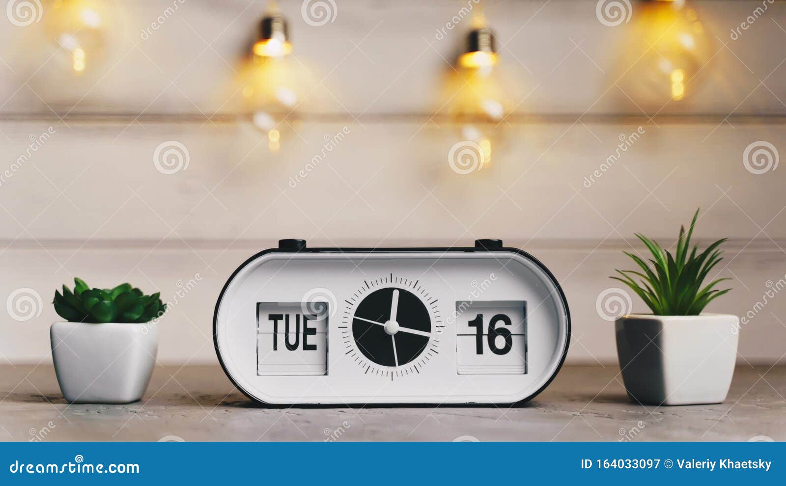 A White Flip Clock on Table Turns through Month, Flipping Days and Date ...