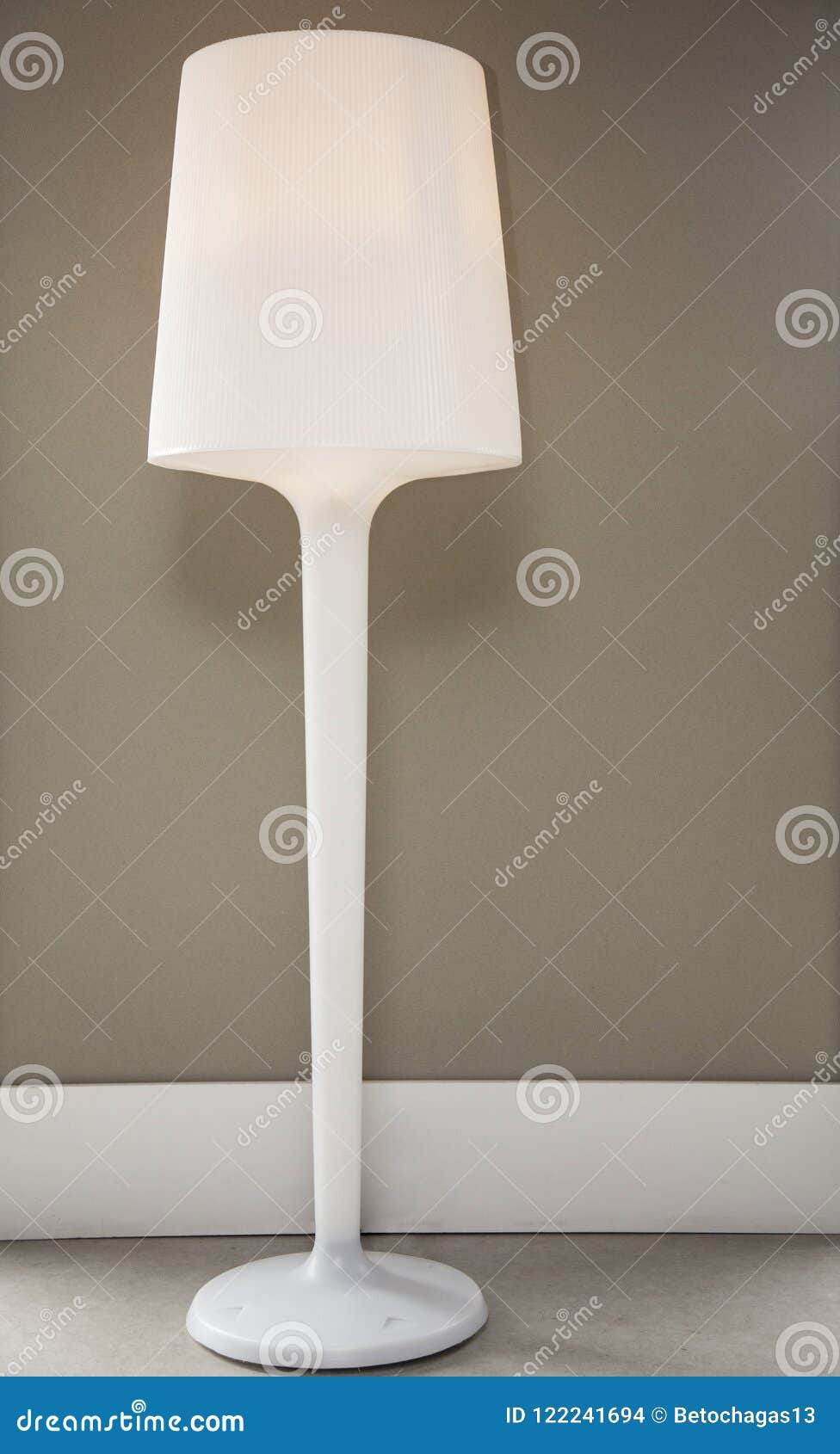 White Floor Lamp in a Empty Room in Front of a Brown Wall Stock Photo ...