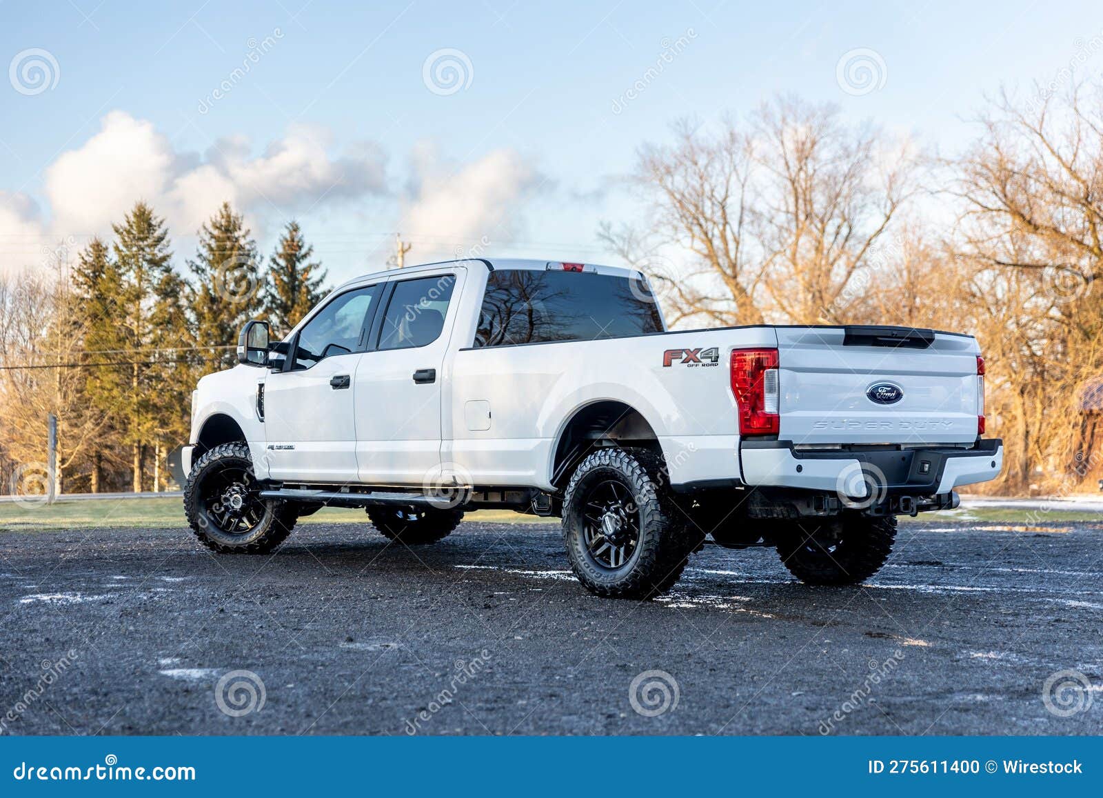 White Ford Superduty Truck Parked on a Concrete Surface in a Natural ...