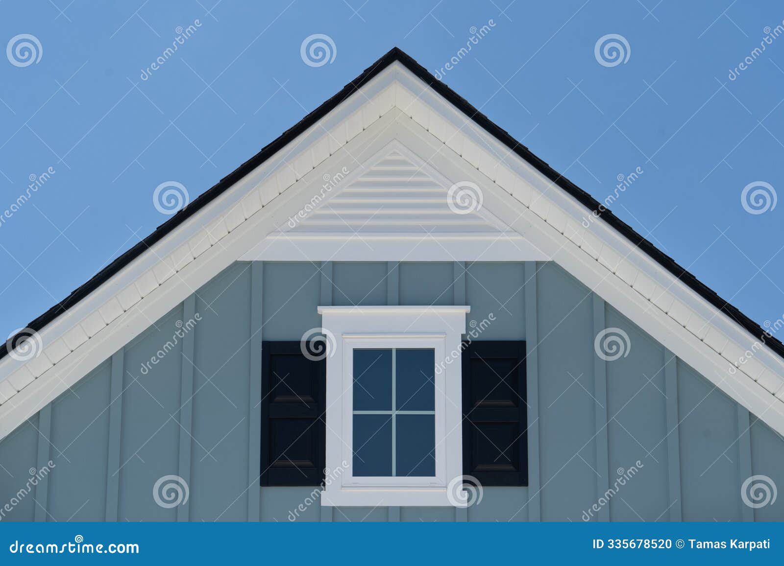 White Frame Attic Window Vent on Blue Siding, Gable, Corbel, Louver on ...