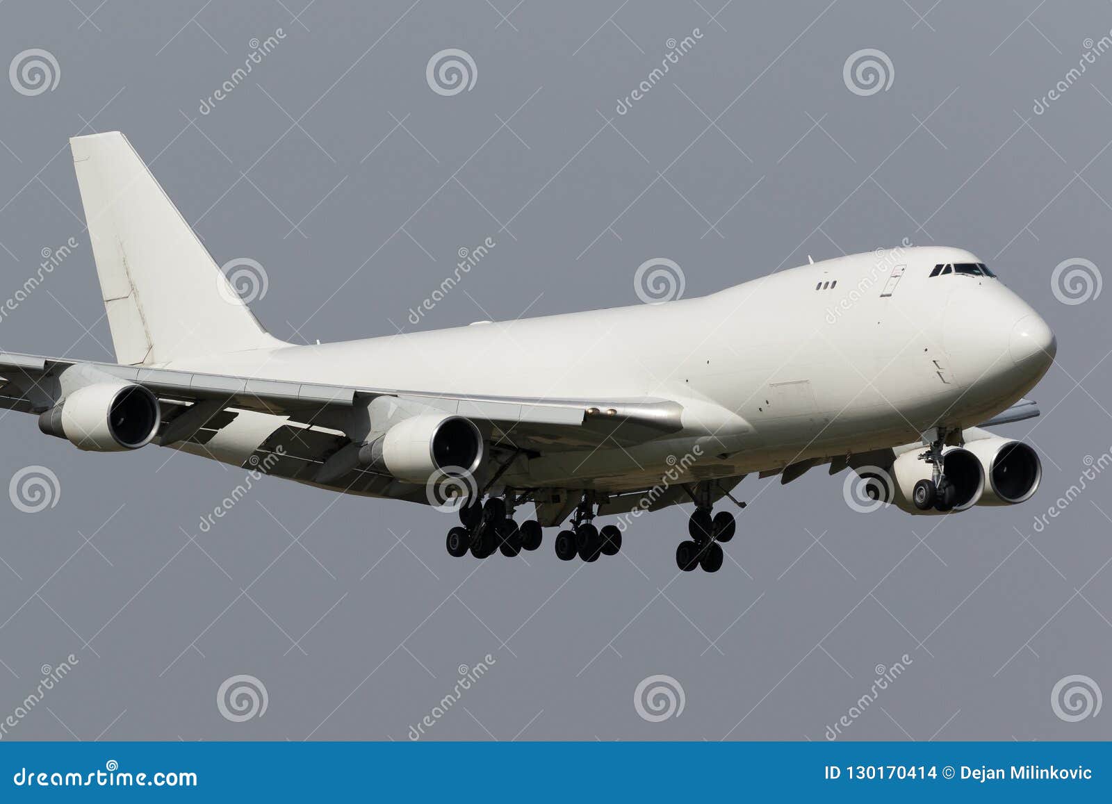 White freighter jumbo jet stock photo. Image of airplane - 130170414