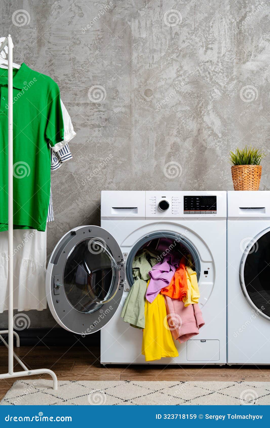 Open Front Loading Washing Machine with Colourful Clothes Stock Image ...