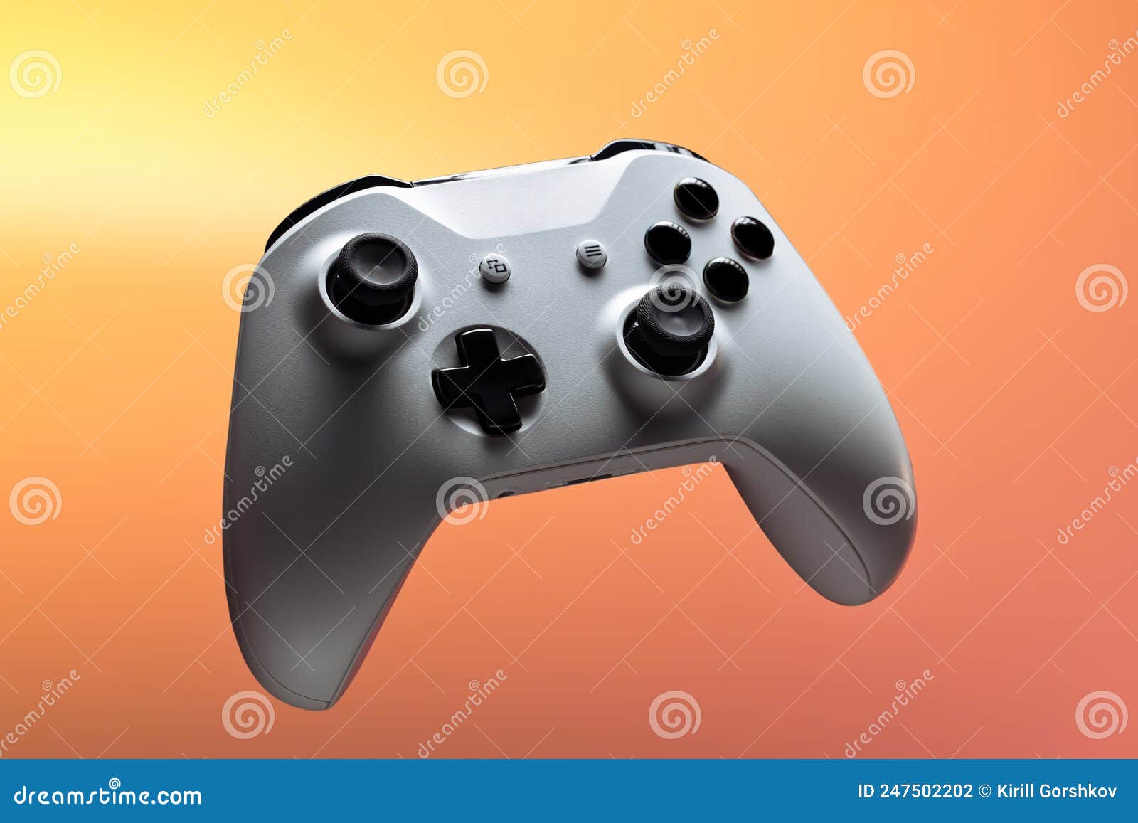 White Gamepad on an Abstract Orange Background, Modern Game Console ...
