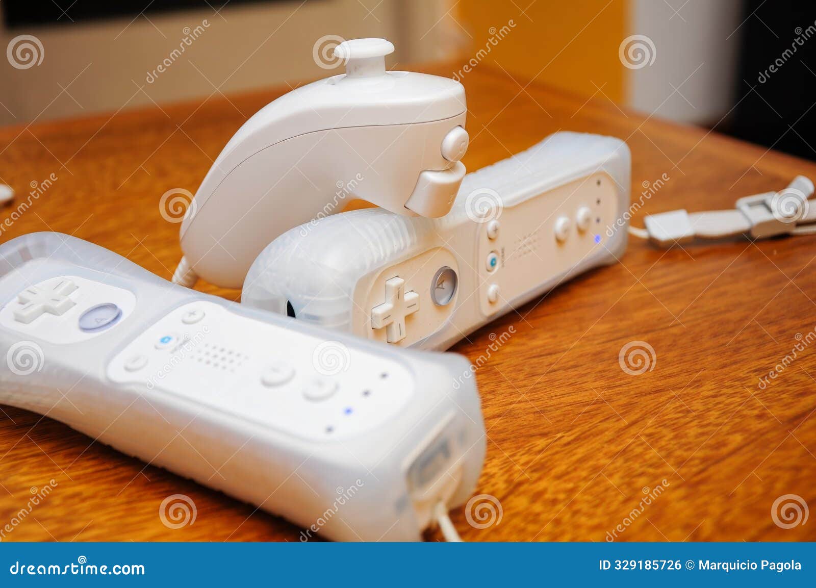 White Gaming Controllers on Wooden Table Ready for Fun Stock Photo ...