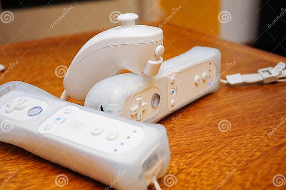 White Gaming Controllers on Wooden Table Ready for Fun Stock Photo ...