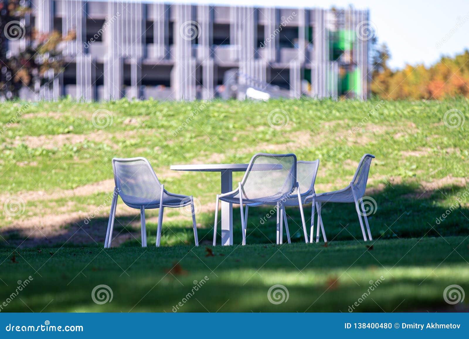 White Garden Table and Chairs on a Patio Patio Outside of an Office ...
