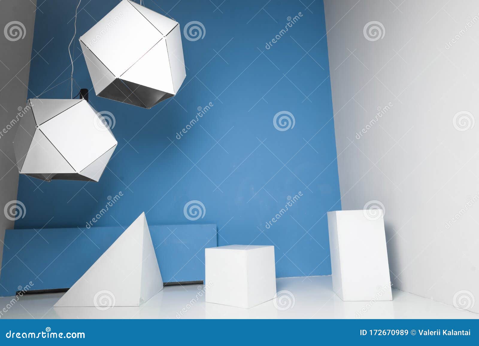 White Geometric Shapes in Room with Blue Wall Stock Image - Image of ...