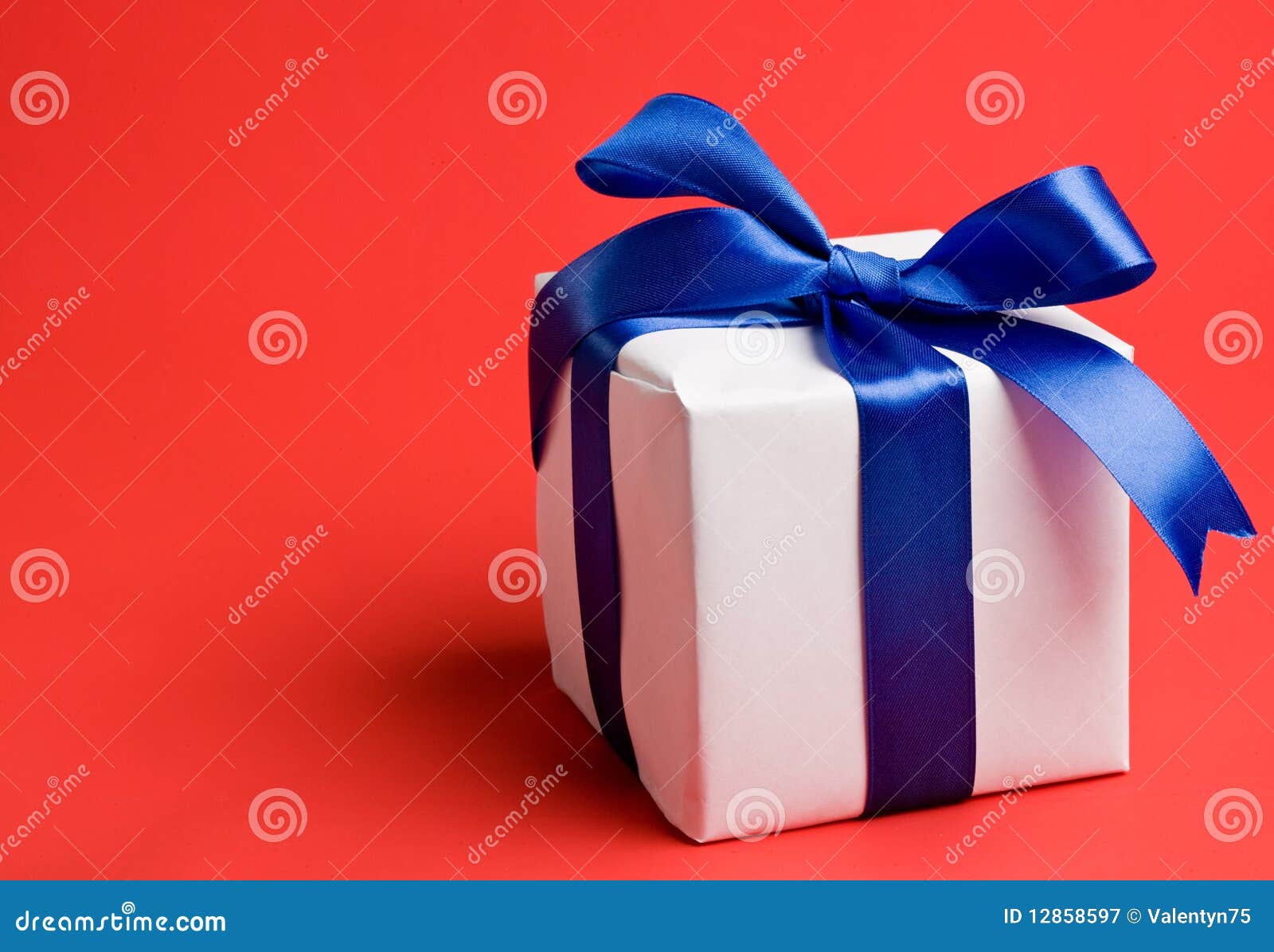 White Gift with a Blue Ribbon Stock Image - Image of surprise, party ...