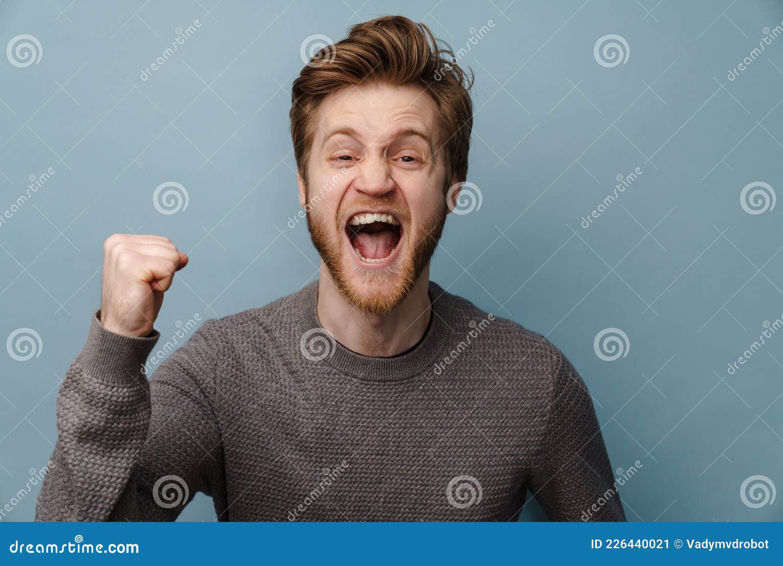 White Ginger Man with Beard Screaming while Making Winner Gesture Stock ...