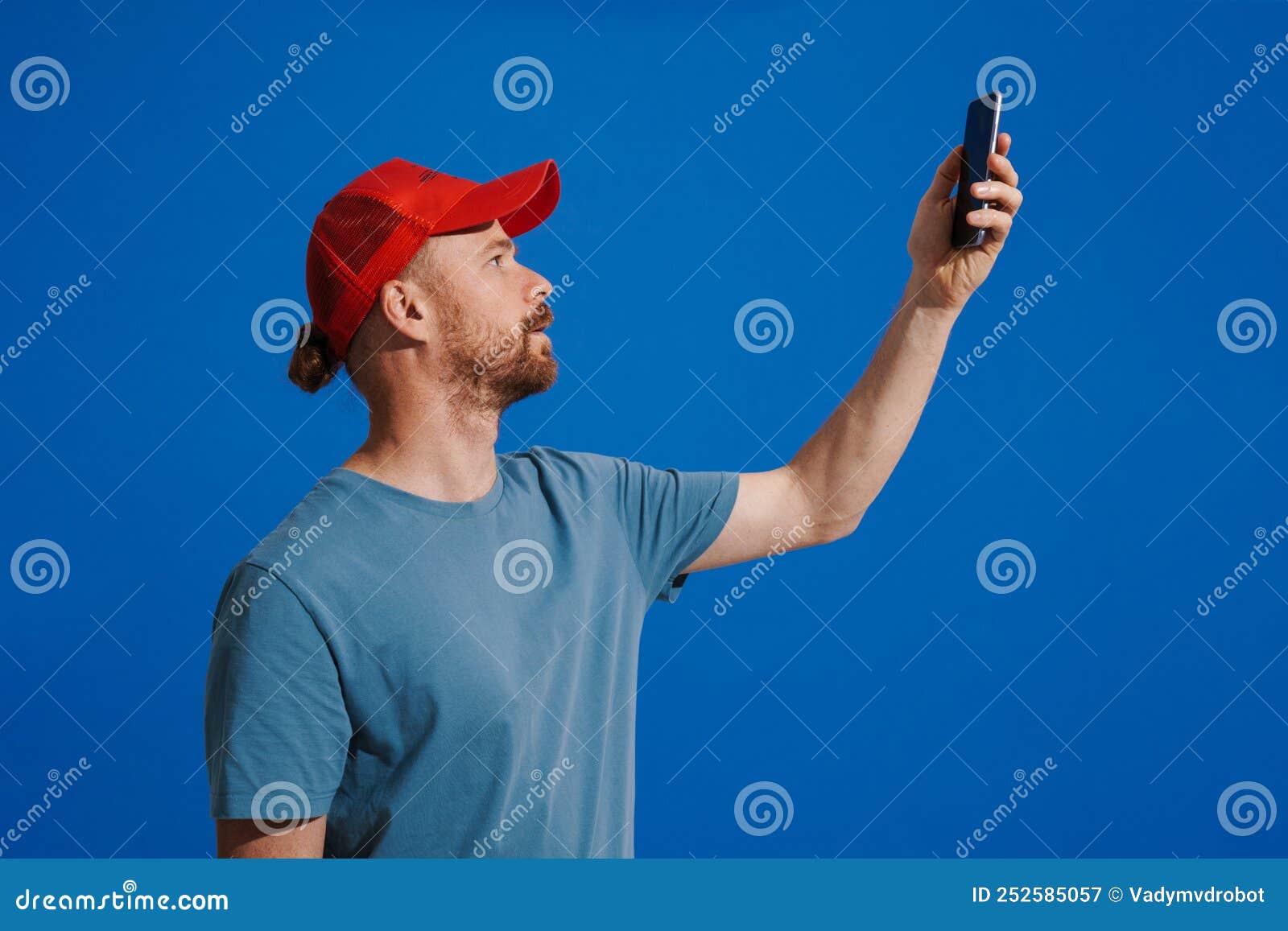 White Ginger Man Wearing Cap Using Mobile Phone Stock Image - Image of ...