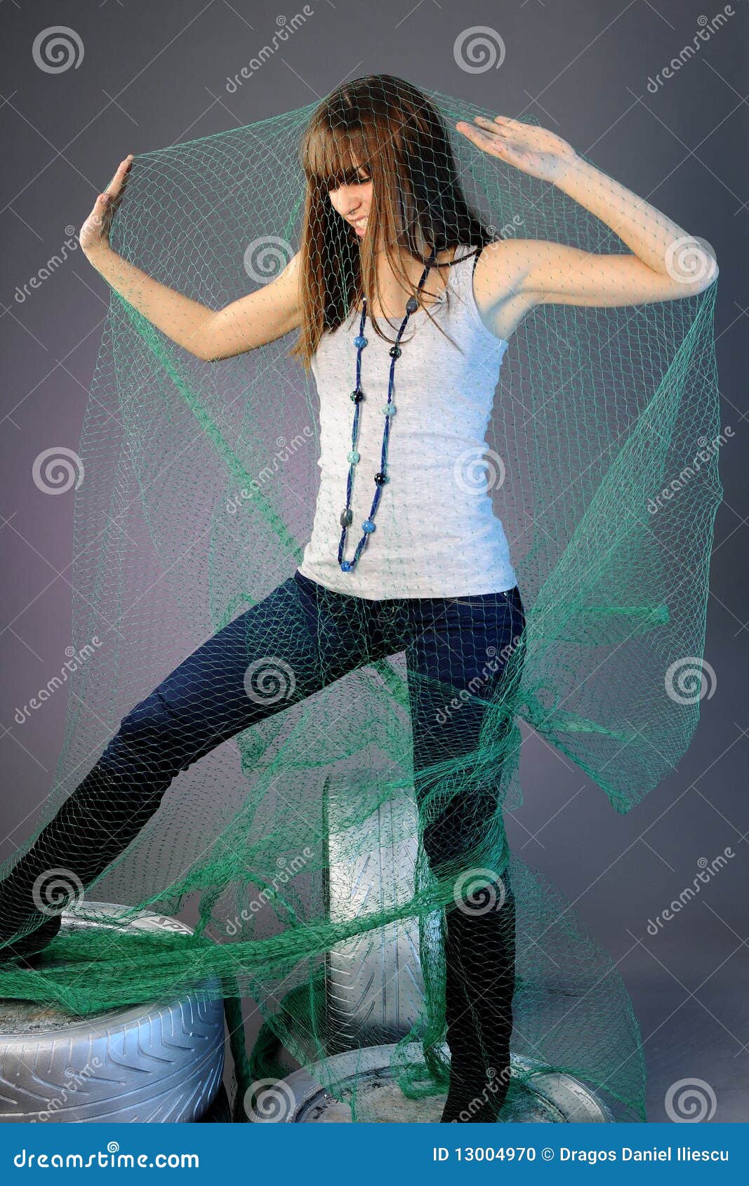 White Girl in Netting Posing on Tyres Stock Photo - Image of listening ...