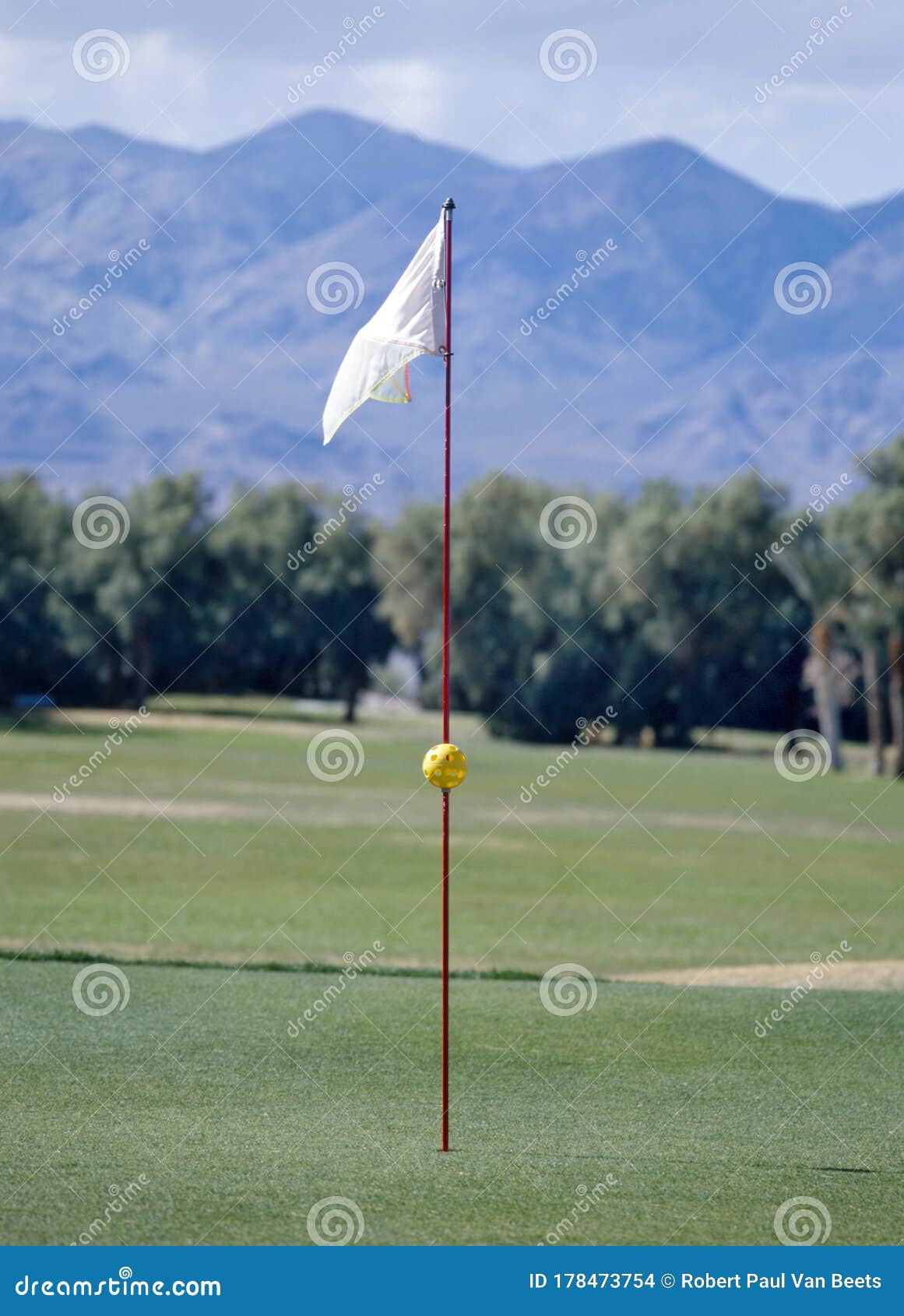 A White Golf Flag Blowing in the Wind Stock Photo - Image of lawn ...