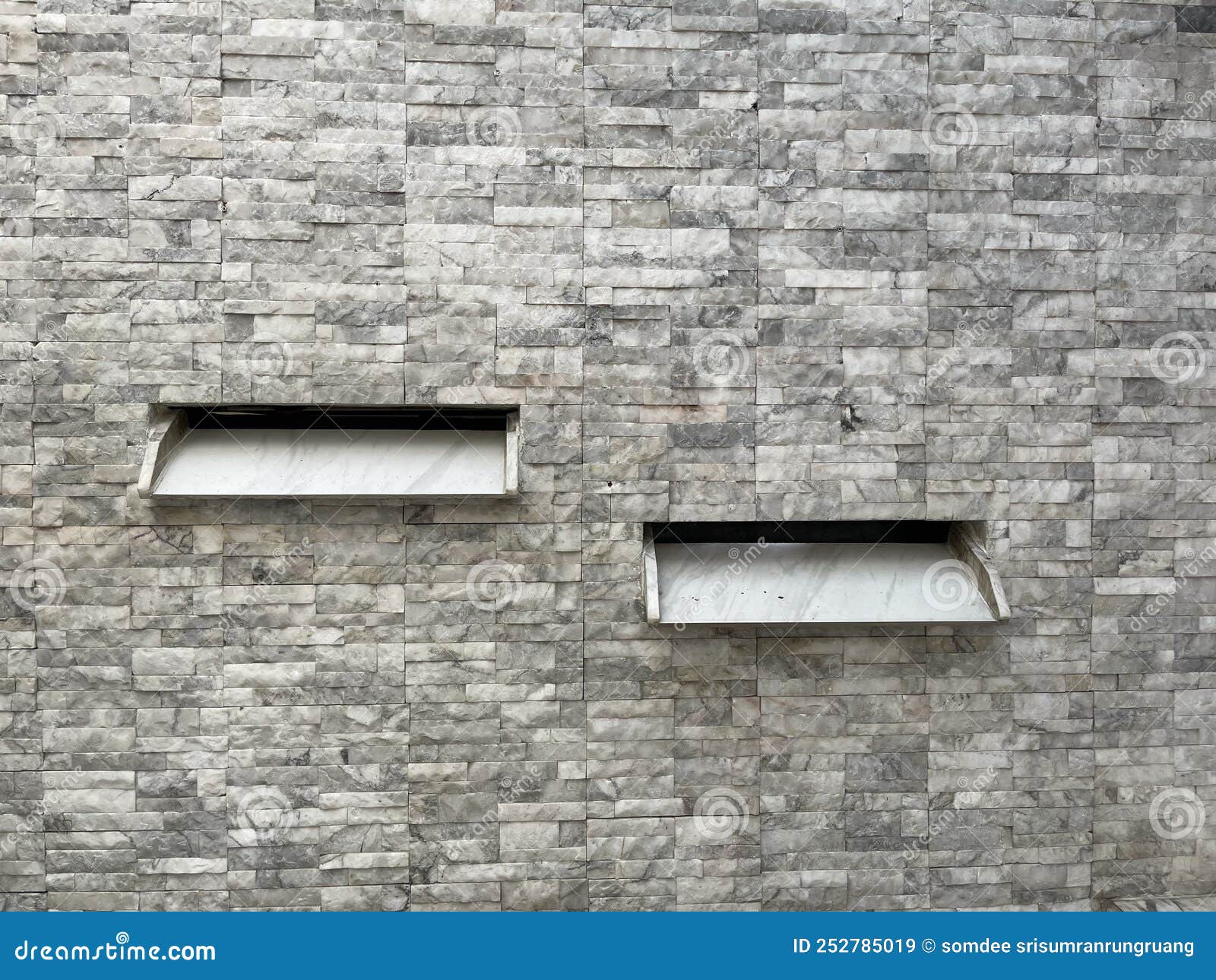 The White Granite Wall Has Two Holes for Water To Flow through. Stock ...