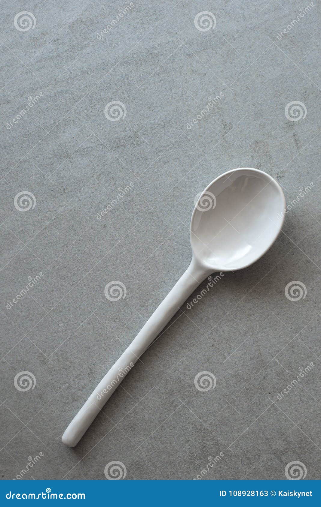 White and Gray Spoon Ceramic on a Gray Background Stock Image - Image ...
