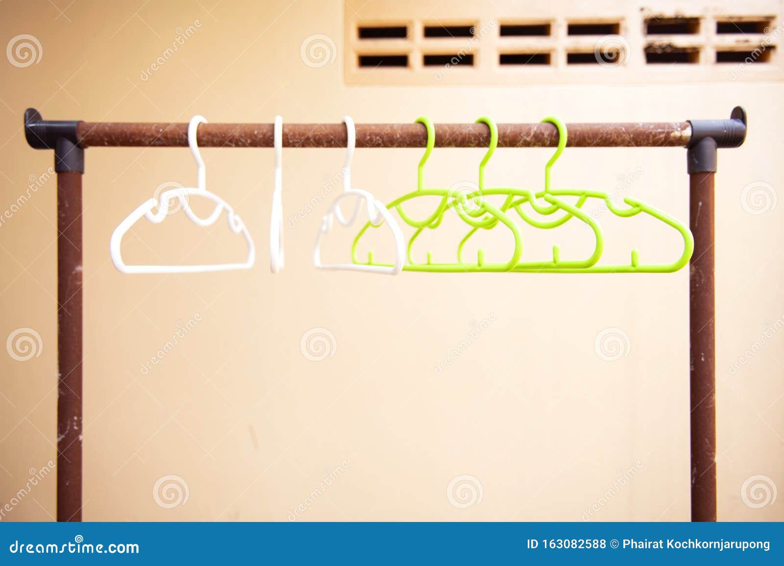 White and Green Clothes Hangers Hanging on the Clothes Stock Photo ...