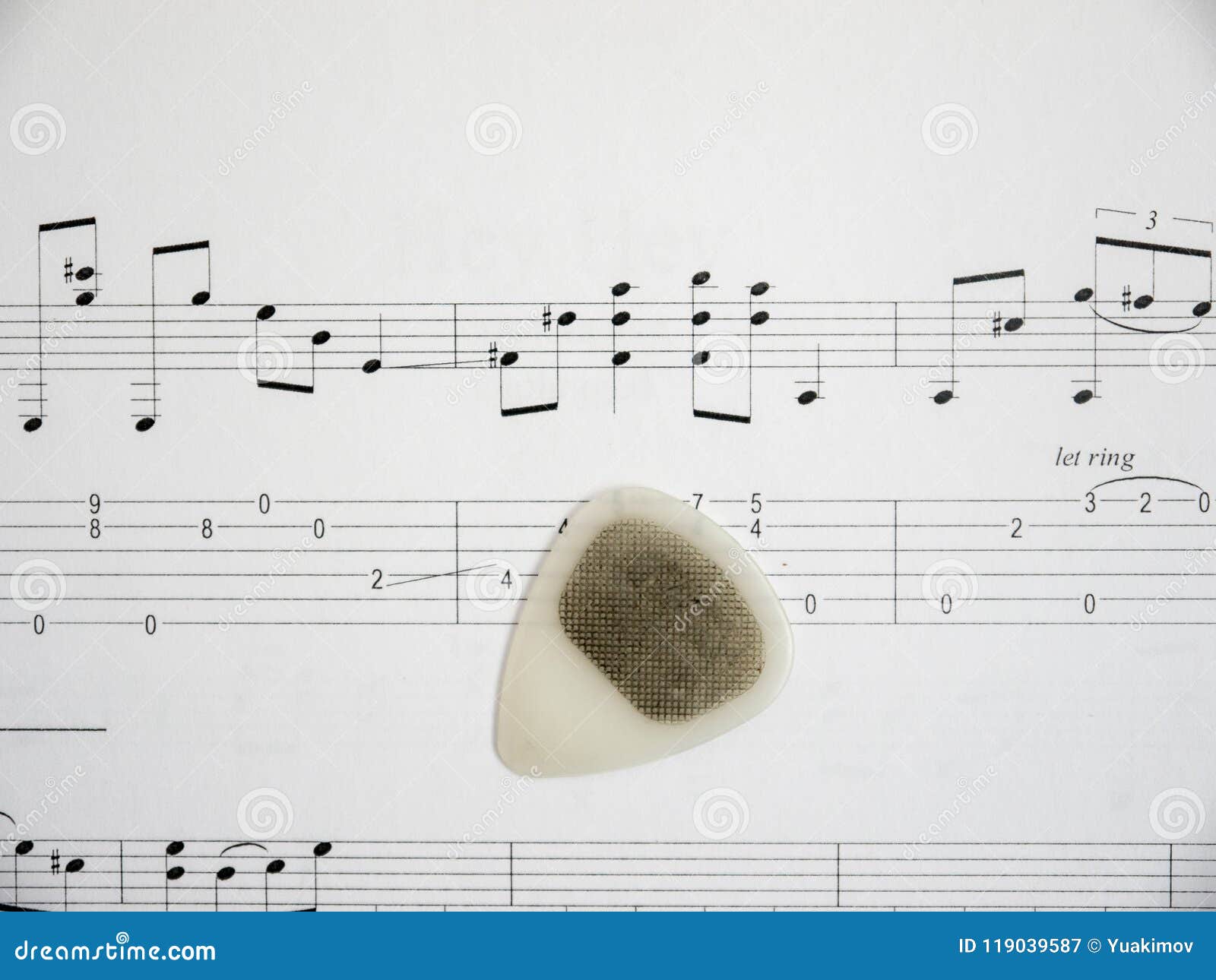 Guitar Pick on Note Sheet with Tabs Stock Image - Image of musical ...