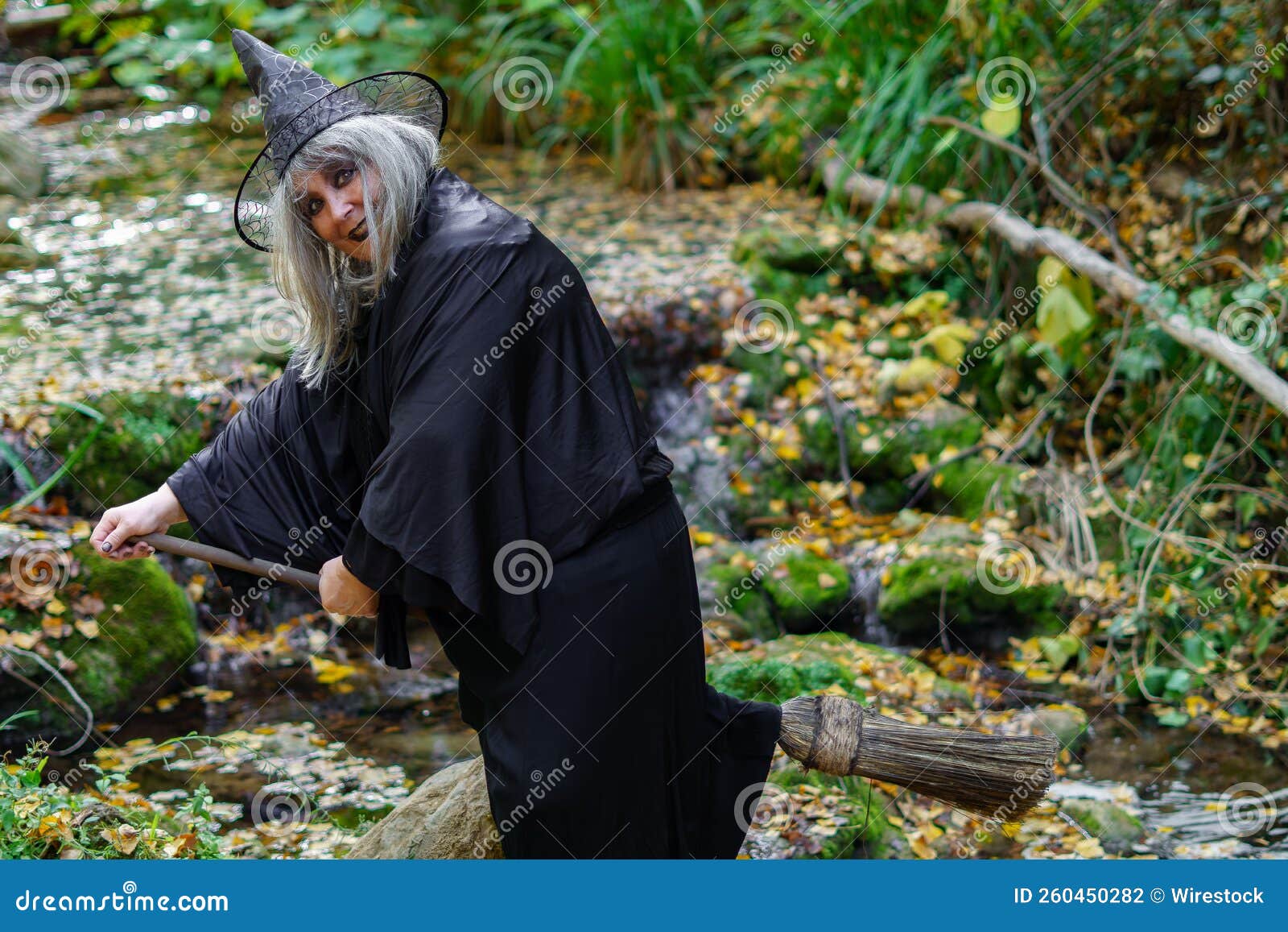 White-haired Witch Flying on Her Broom Stock Photo - Image of white ...