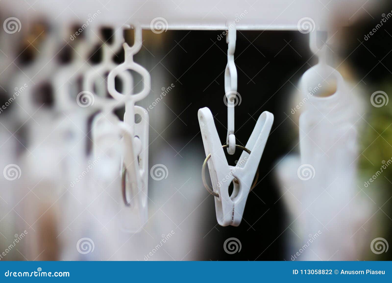 White Hanging Cloth Clippers on the Rack Stock Photo - Image of work ...