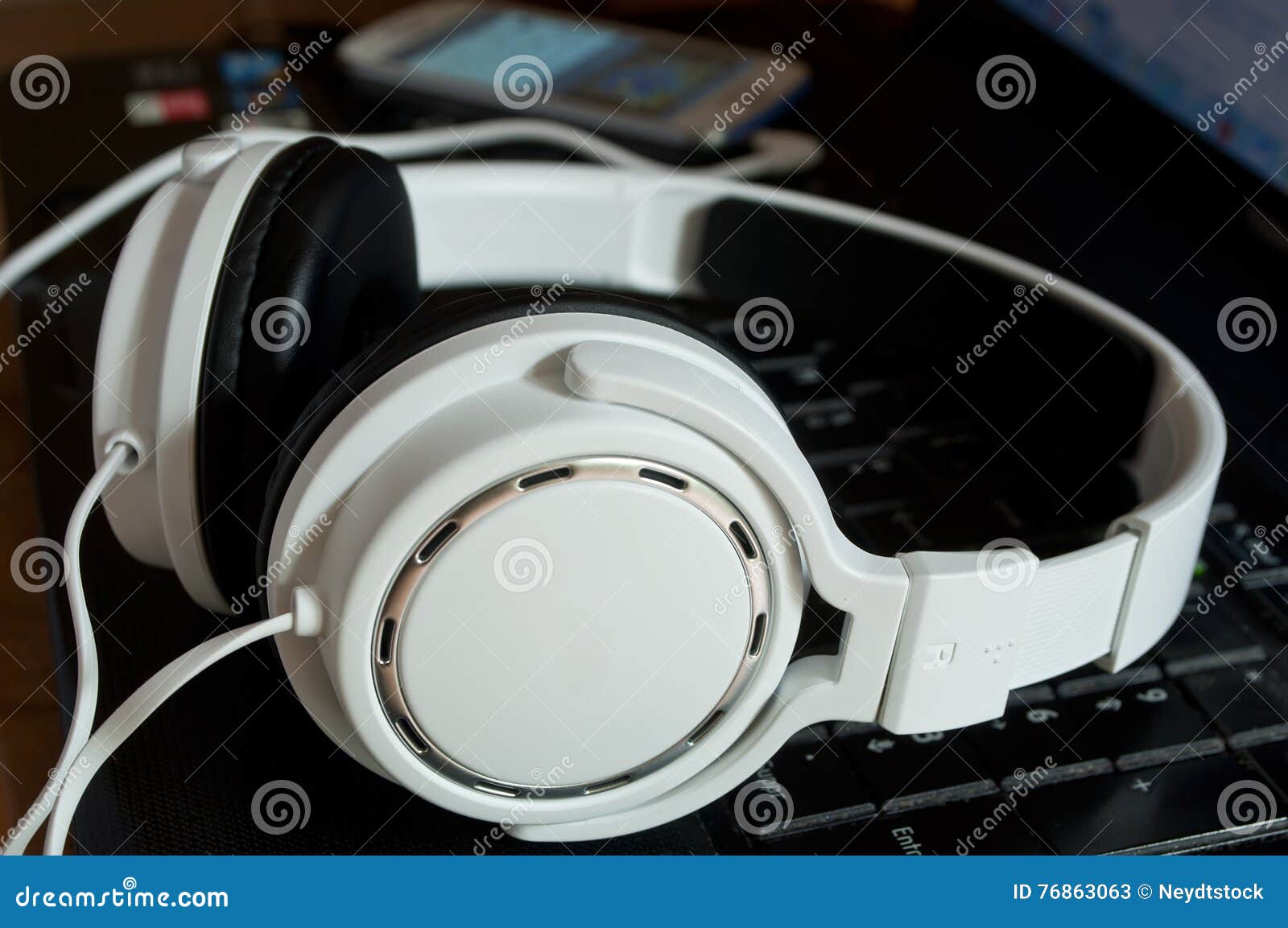 White Headphones on Computer Stock Image - Image of white, device: 76863063