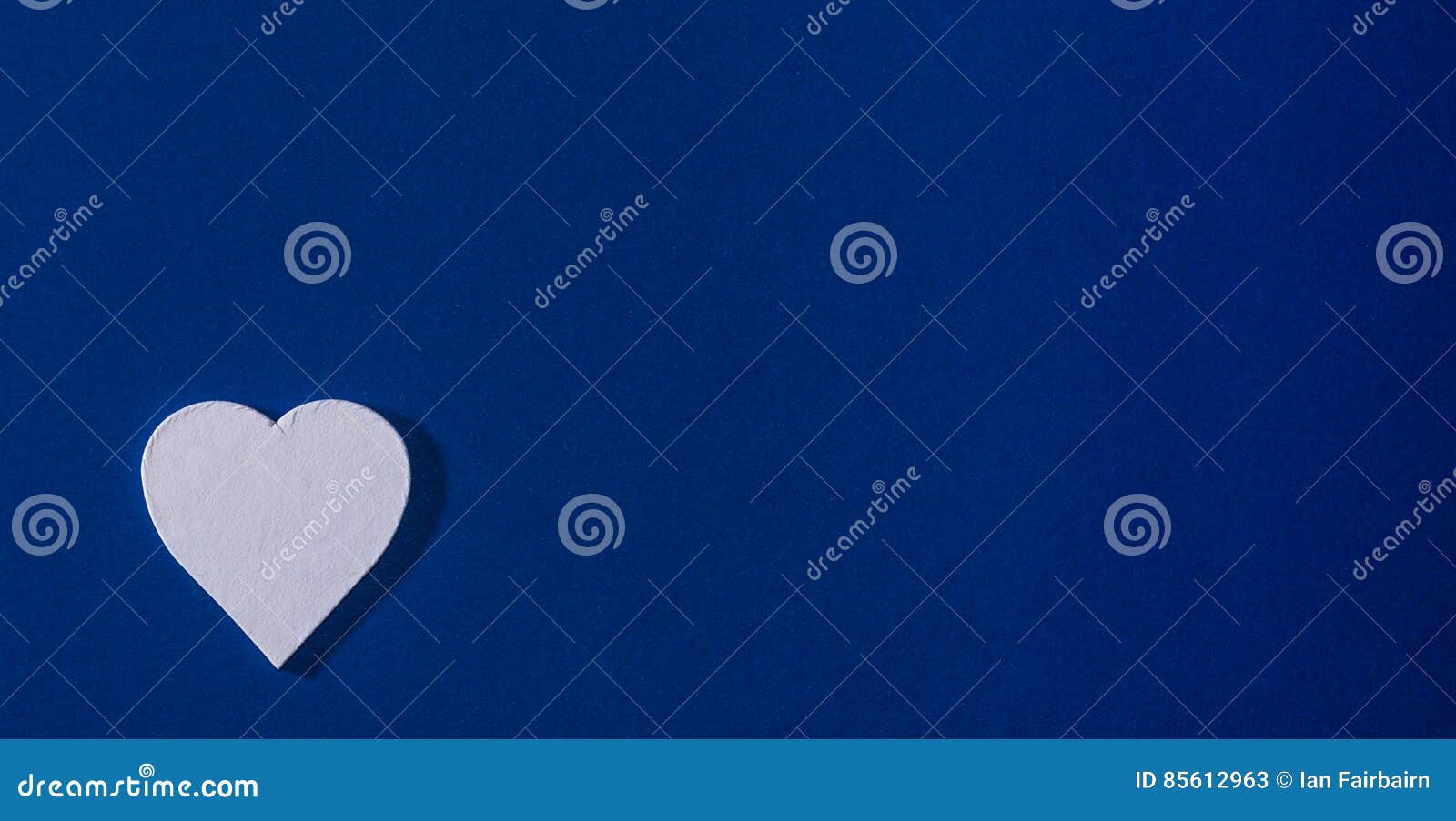 White heart on blue card stock image. Image of symbol - 85612963
