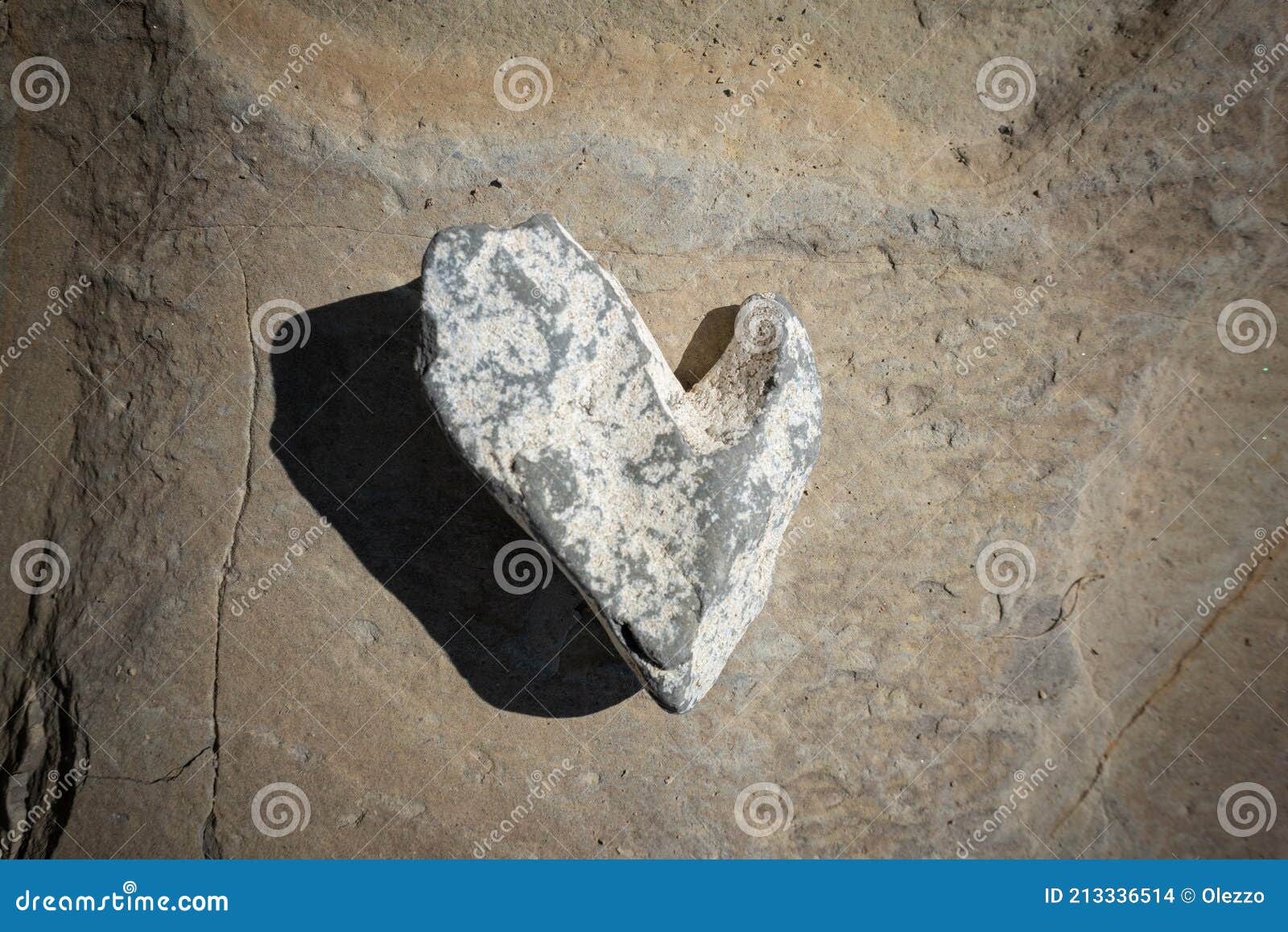 White Heart-shaped Stone on a Stone Surface, Abstract Background and ...