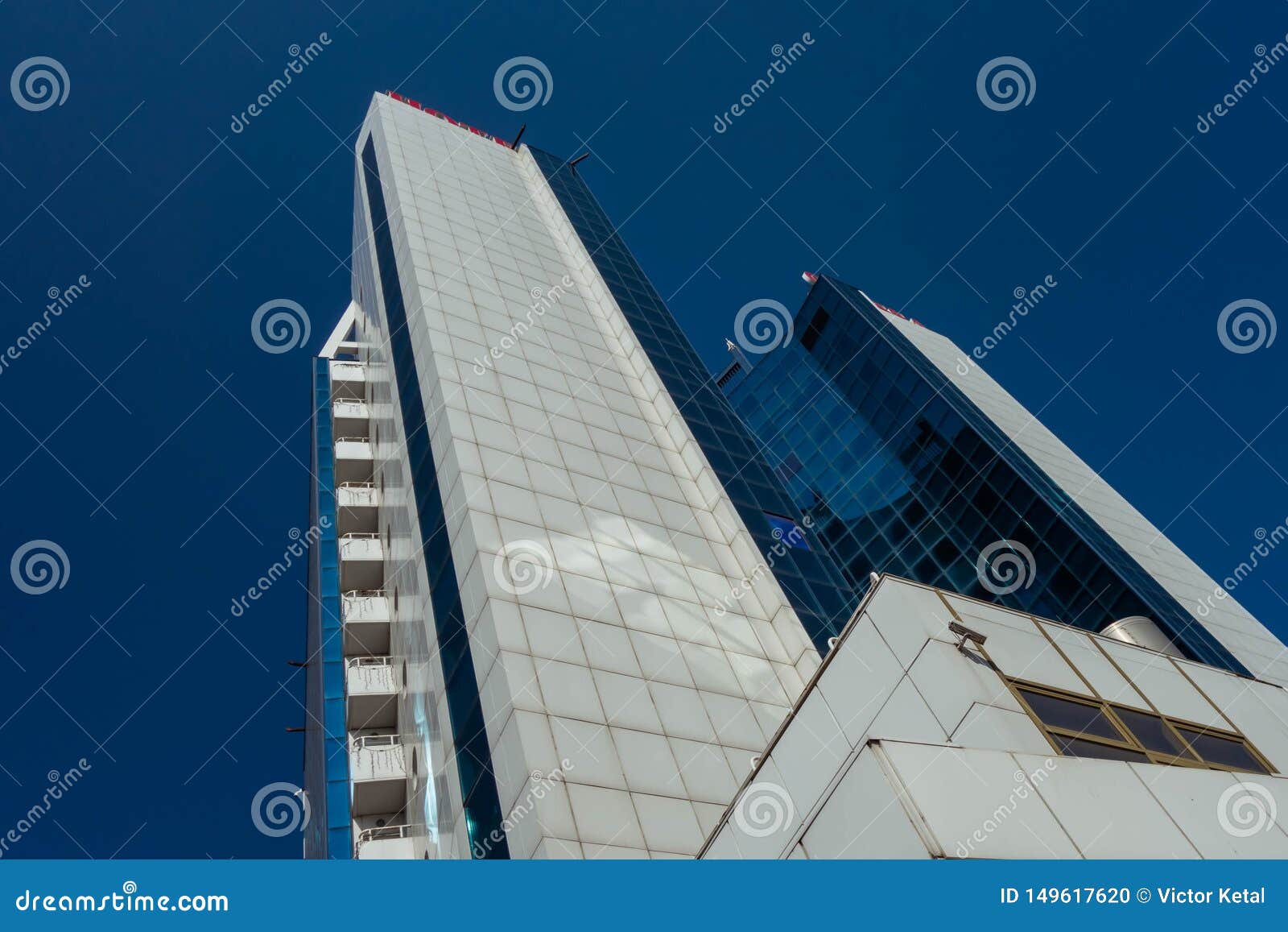 White High-rise Building Against a Blue Sky Stock Photo - Image of ...