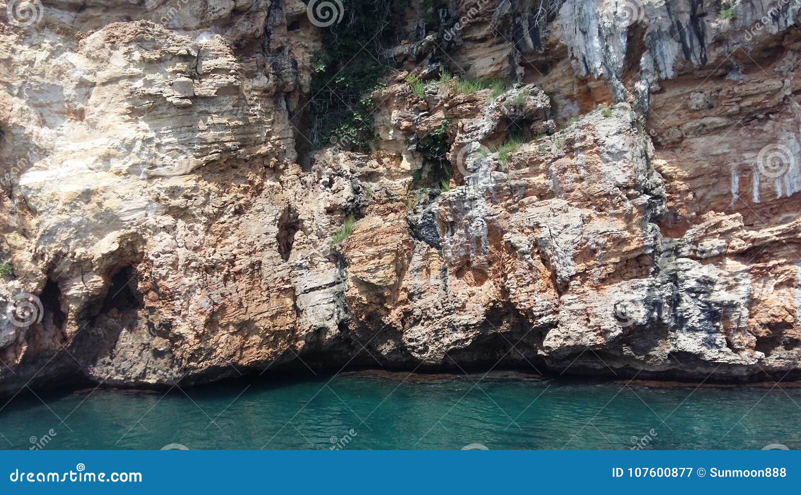 High rock cliff in the sea stock image. Image of stone - 107600877