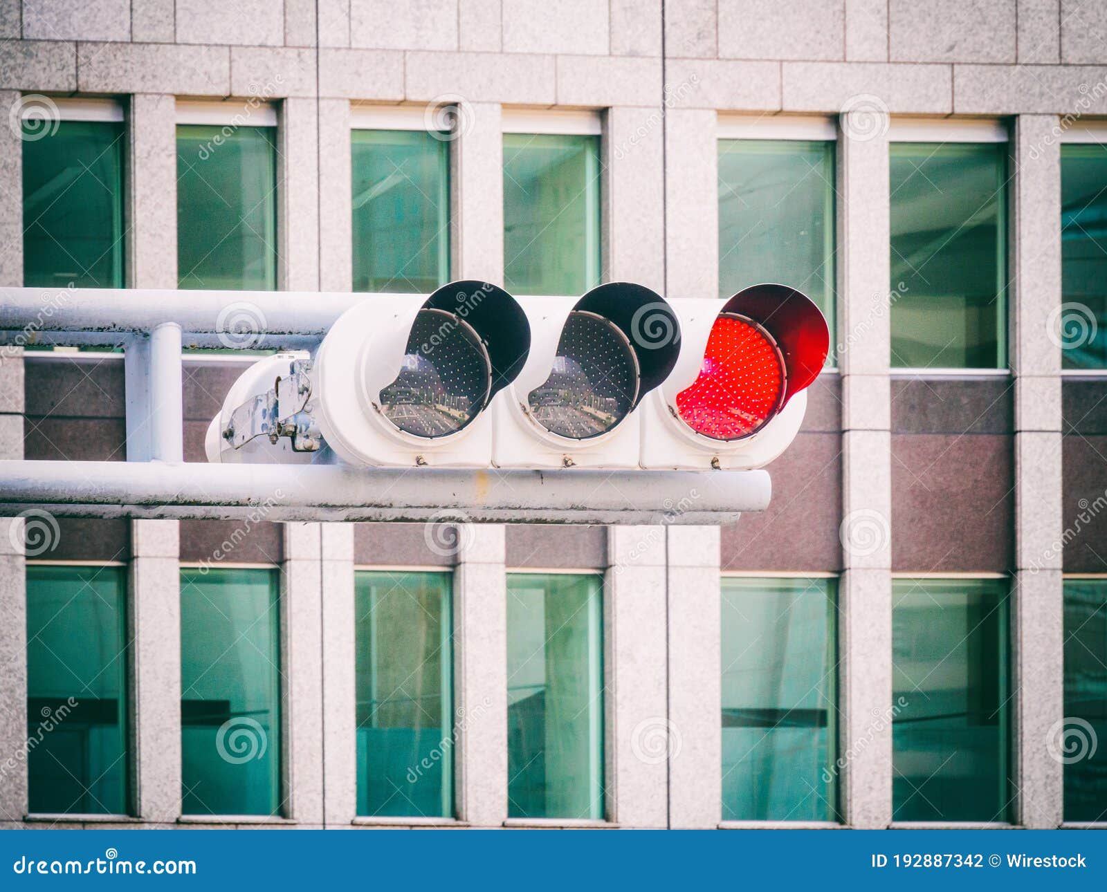 White Horizontal Traffic Light with an Illuminated Red Light on a Pole ...