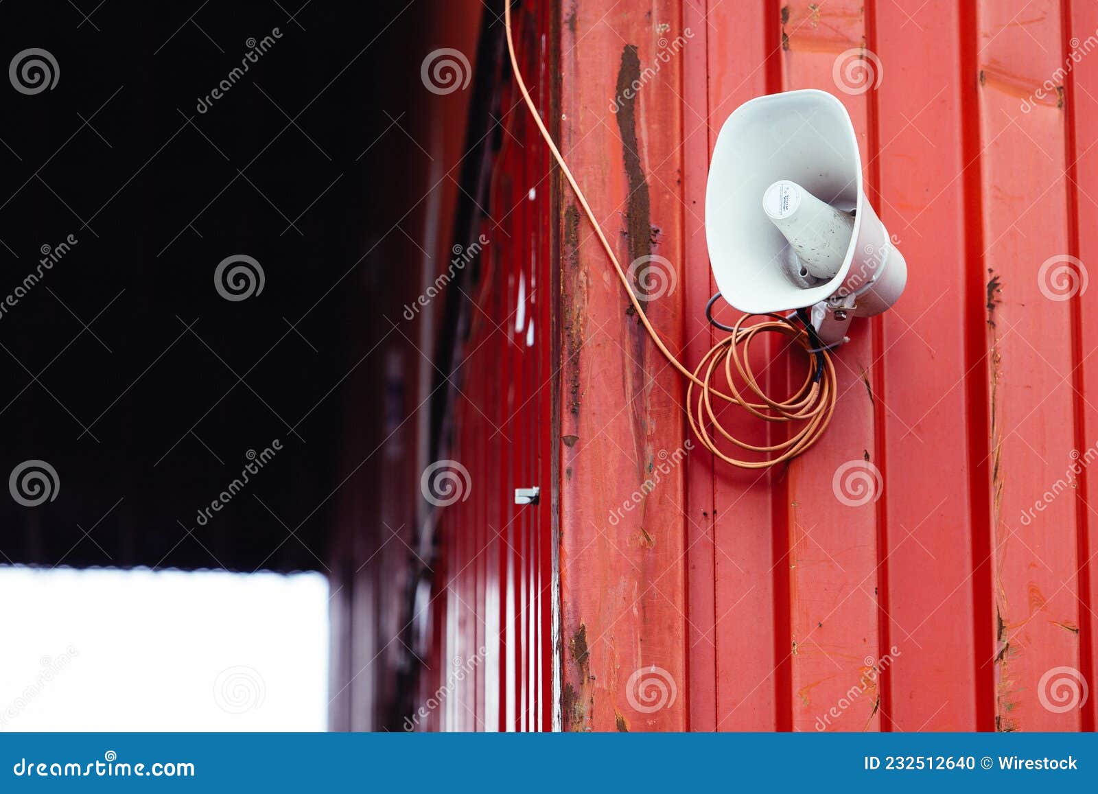 White Horn Loudspeaker Mounted on the Building S Red Wall Stock Photo ...