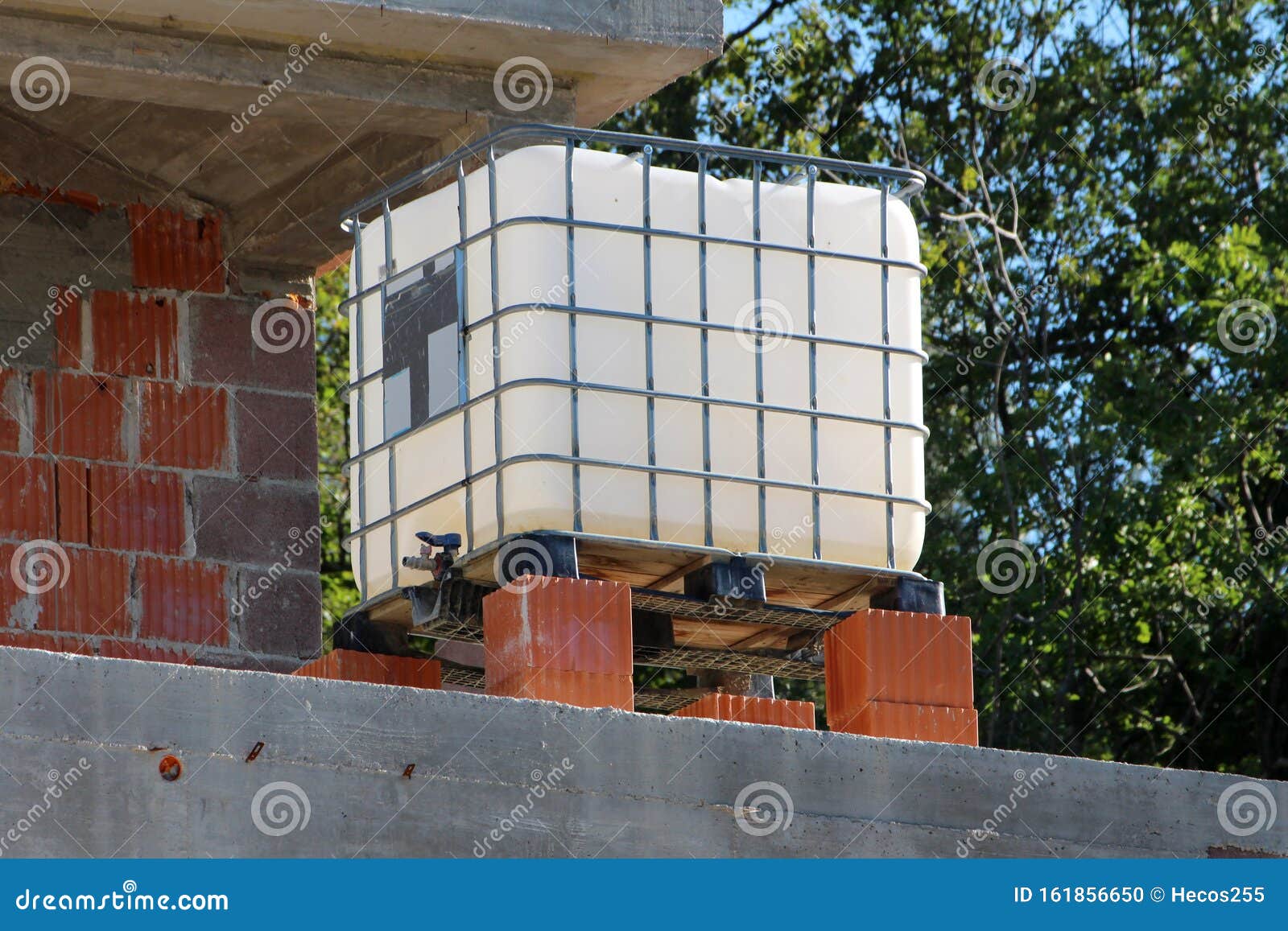 White Intermediate Bulk Container Or IBC Plastic Tank Put On Elevated ...