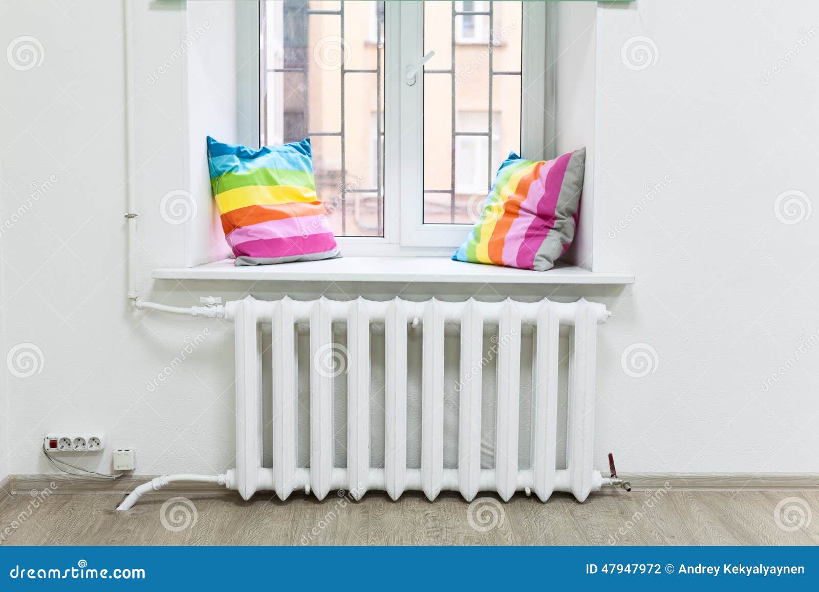 White Iron Radiator of Central Heating Under Windowsill Stock Photo ...
