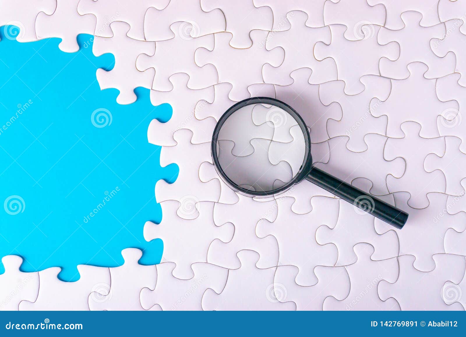 White Jigsaw Puzzle, Magnifier and Missing Pieces with Selective Focus ... White Jigsaw Puzzle, Magnifier and Missing Pieces with Selective Focus ...