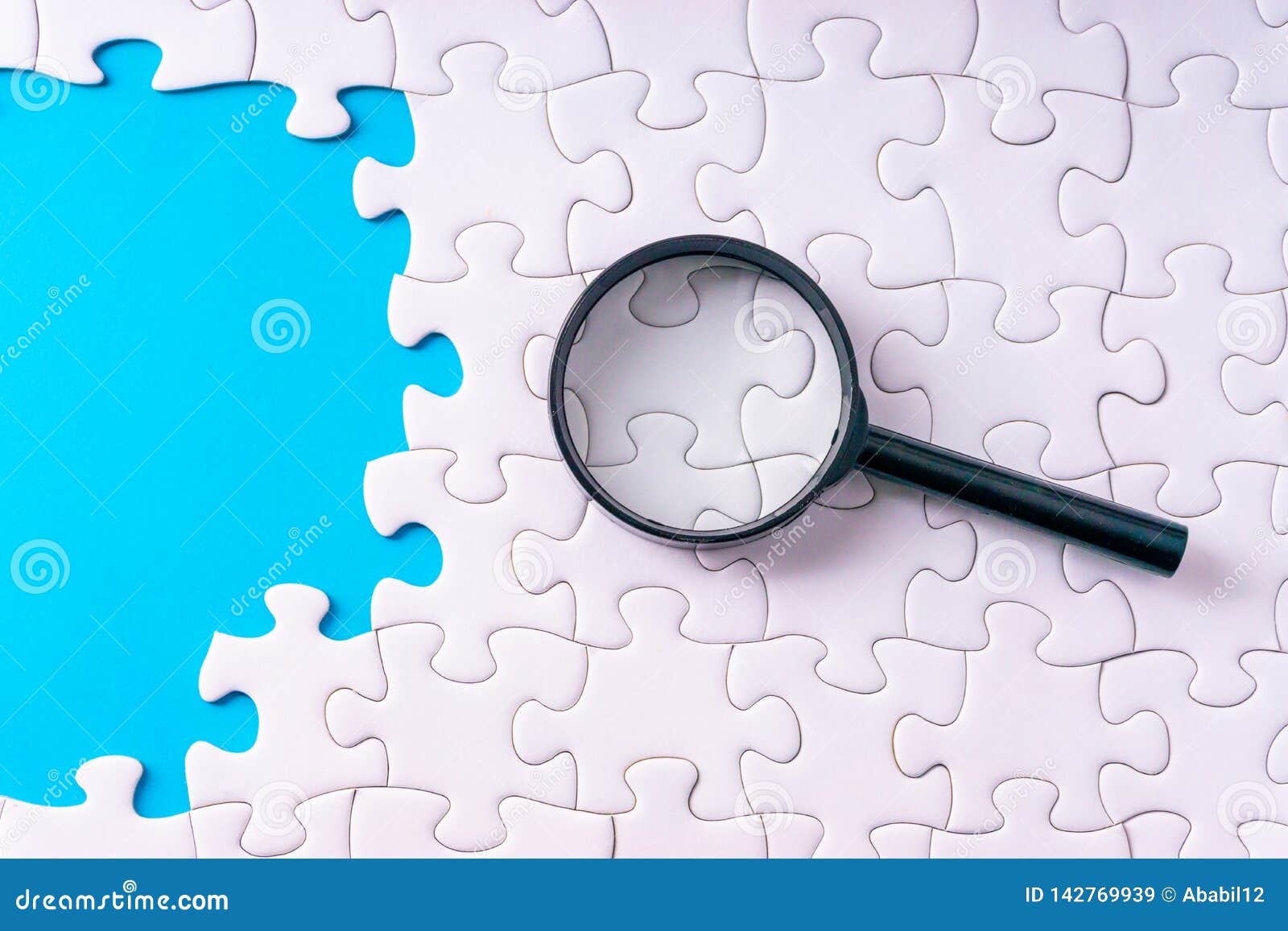 White Jigsaw Puzzle, Magnifier and Missing Pieces with Selective Focus ... White Jigsaw Puzzle, Magnifier and Missing Pieces with Selective Focus ...