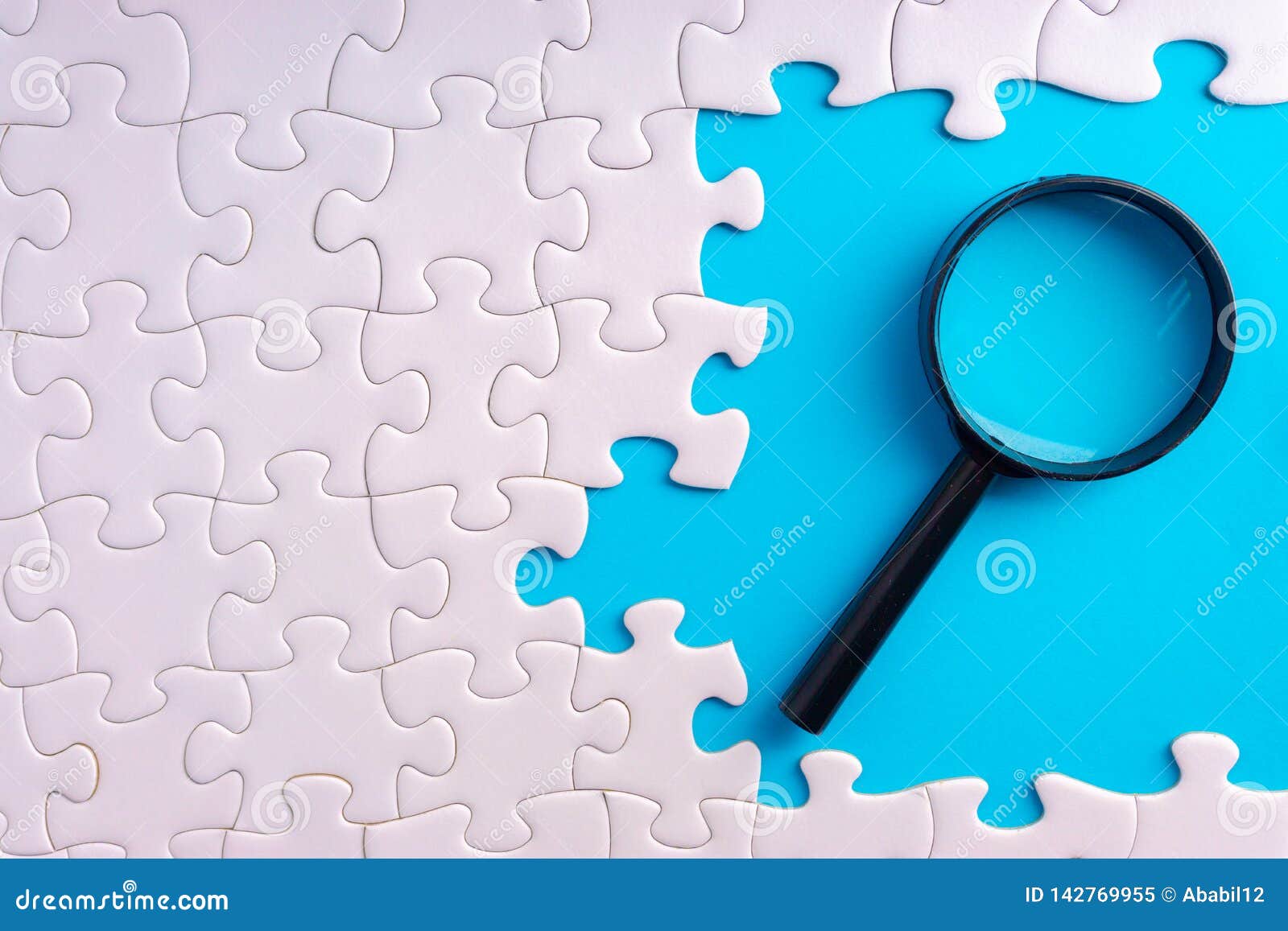 White Jigsaw Puzzle, Magnifier and Missing Pieces with Selective Focus ... White Jigsaw Puzzle, Magnifier and Missing Pieces with Selective Focus ...
