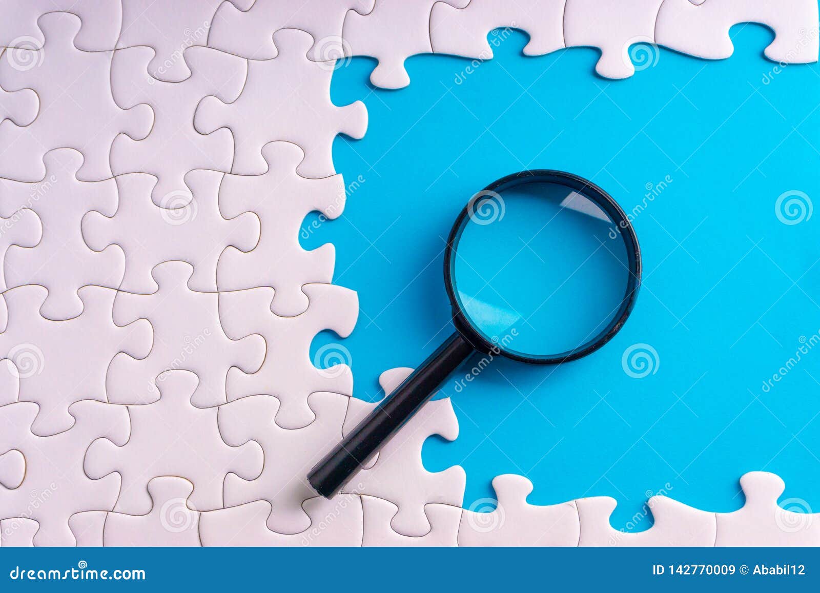 White Jigsaw Puzzle, Magnifier and Missing Pieces with Selective Focus ... White Jigsaw Puzzle, Magnifier and Missing Pieces with Selective Focus ...